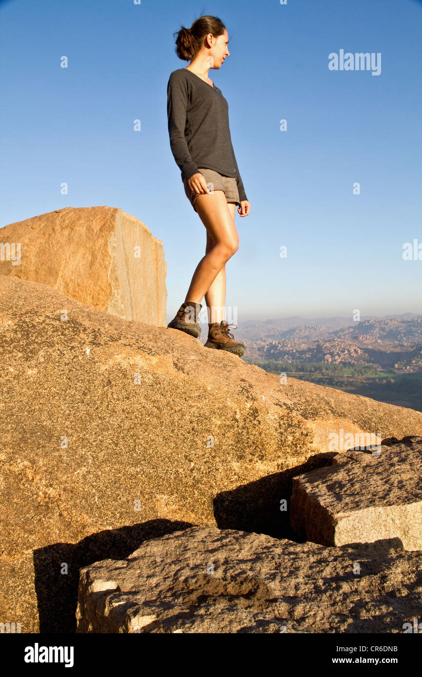 India, Karnataka, Hampi, Young woman walking on rock Stock Photo - Alamy