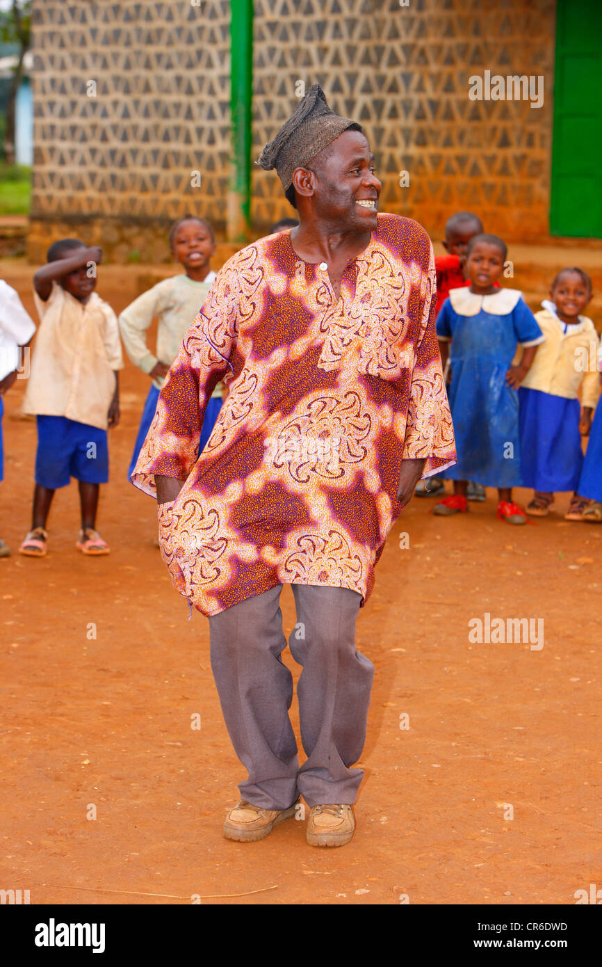 Teacher dancing with his school children, primary school, Bamenda ...
