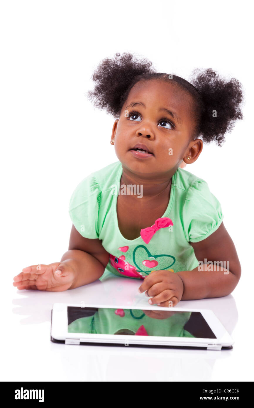 Little african american girl using a tablet pc, isolated on white ...