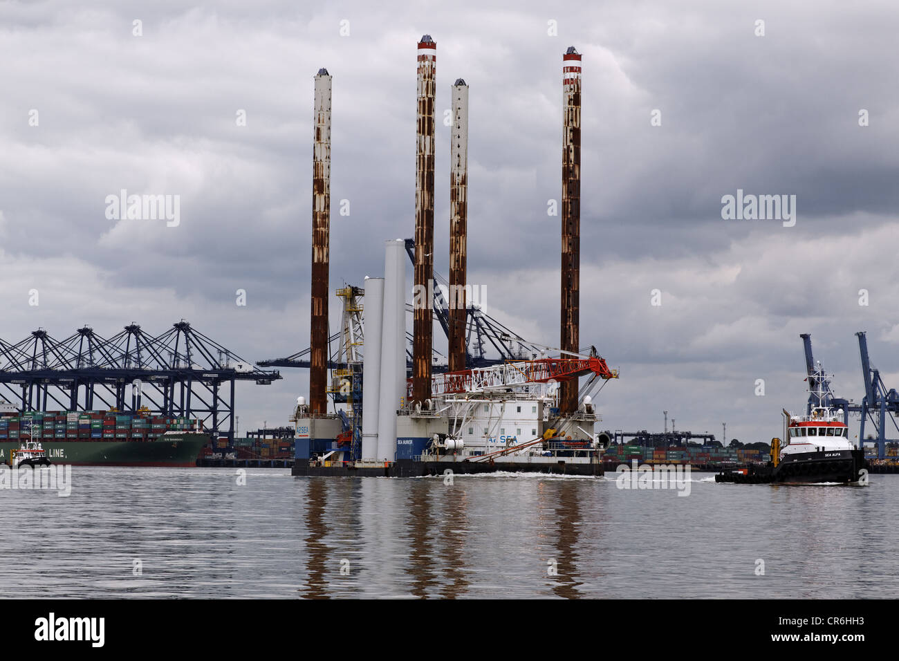 A wind farm construction platform under tow in Harwich Harbour UK Stock ...