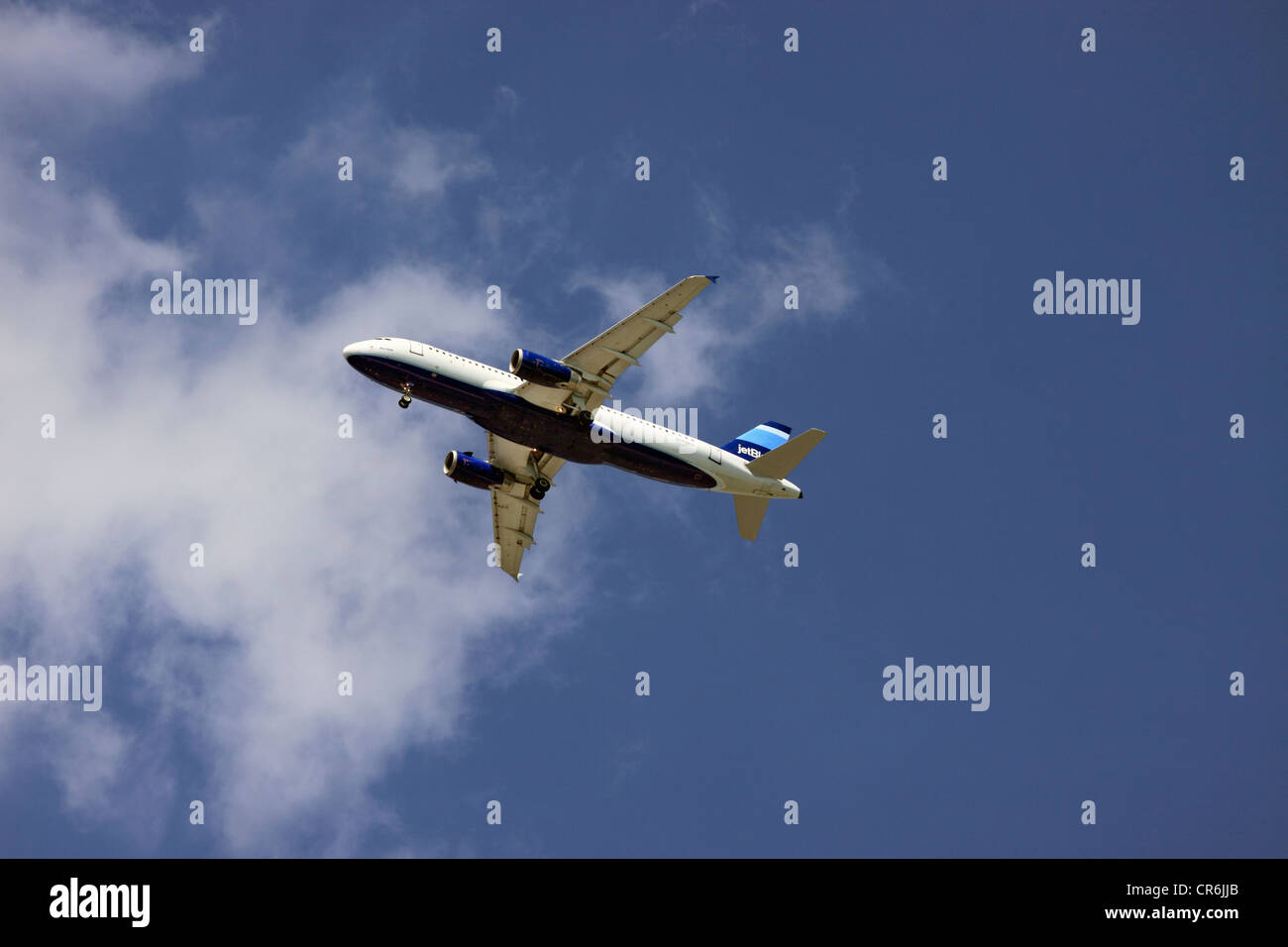 Jet Blue Airbus over Long Beach Long Island on landing approach to JFK ...