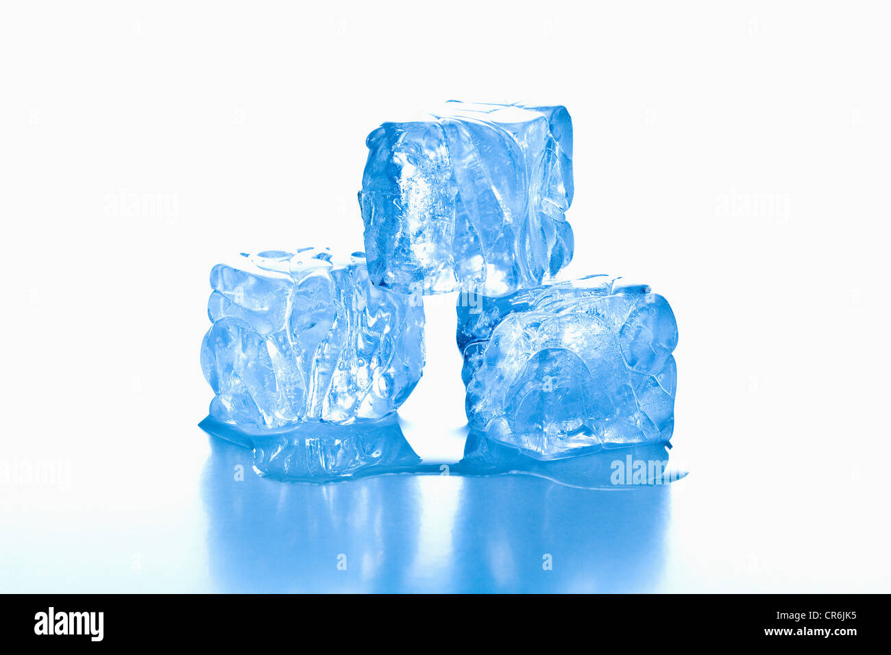 ice cubes shot on reflective white surface Stock Photo - Alamy