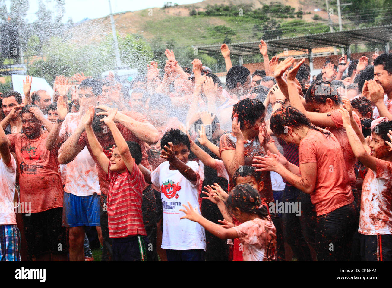 People washing up after the battle of tomatoes during the festival of ...