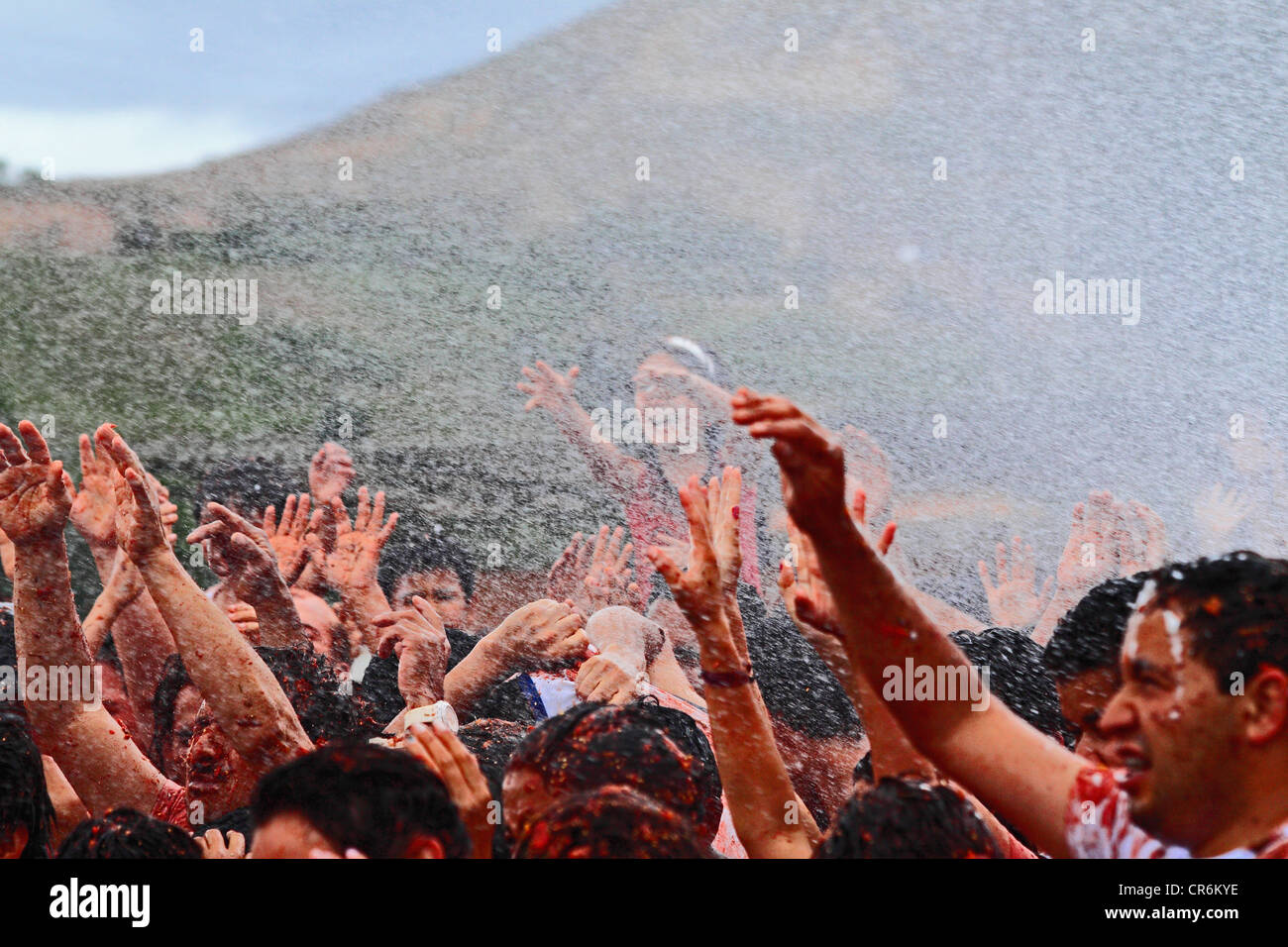 People washing up after the battle of tomatoes during the festival of ...