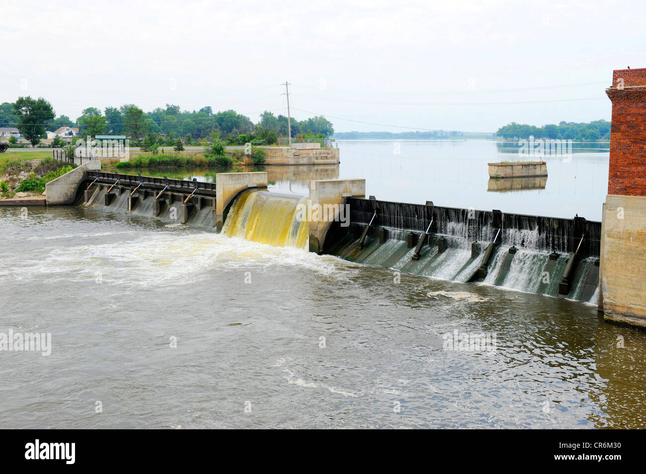 Dam and spillway controls water and creates the Cedar Lake on the Cedar ...
