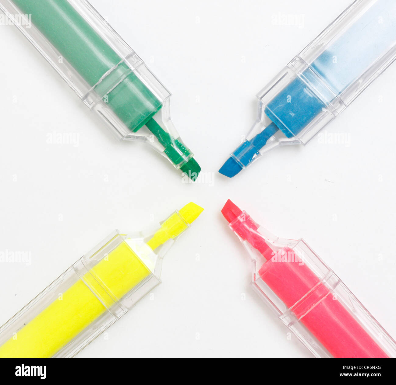 Four markers on a white background Stock Photo - Alamy