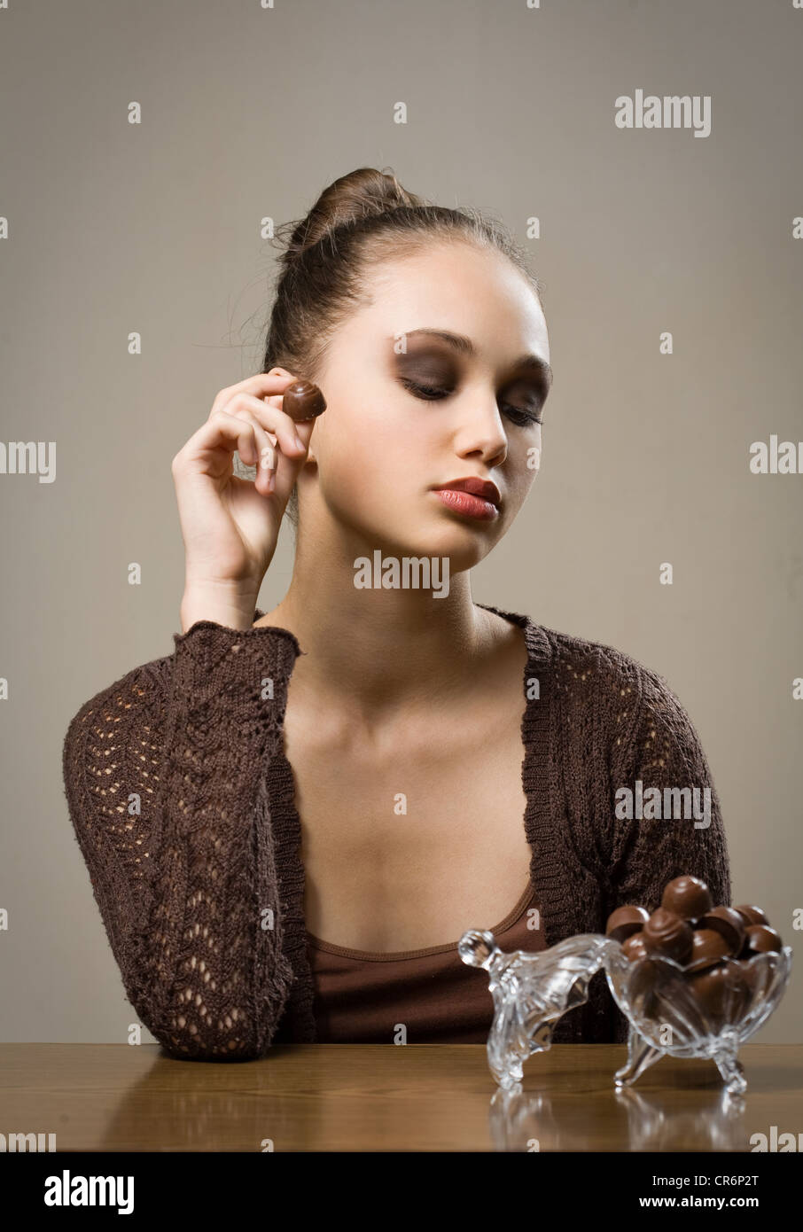 Luxury chocolate, stunning young brunette woman with bonbons Stock ...