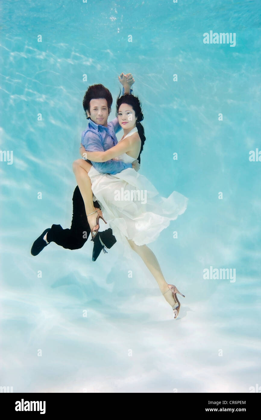 Couple dancing under water Stock Photo - Alamy