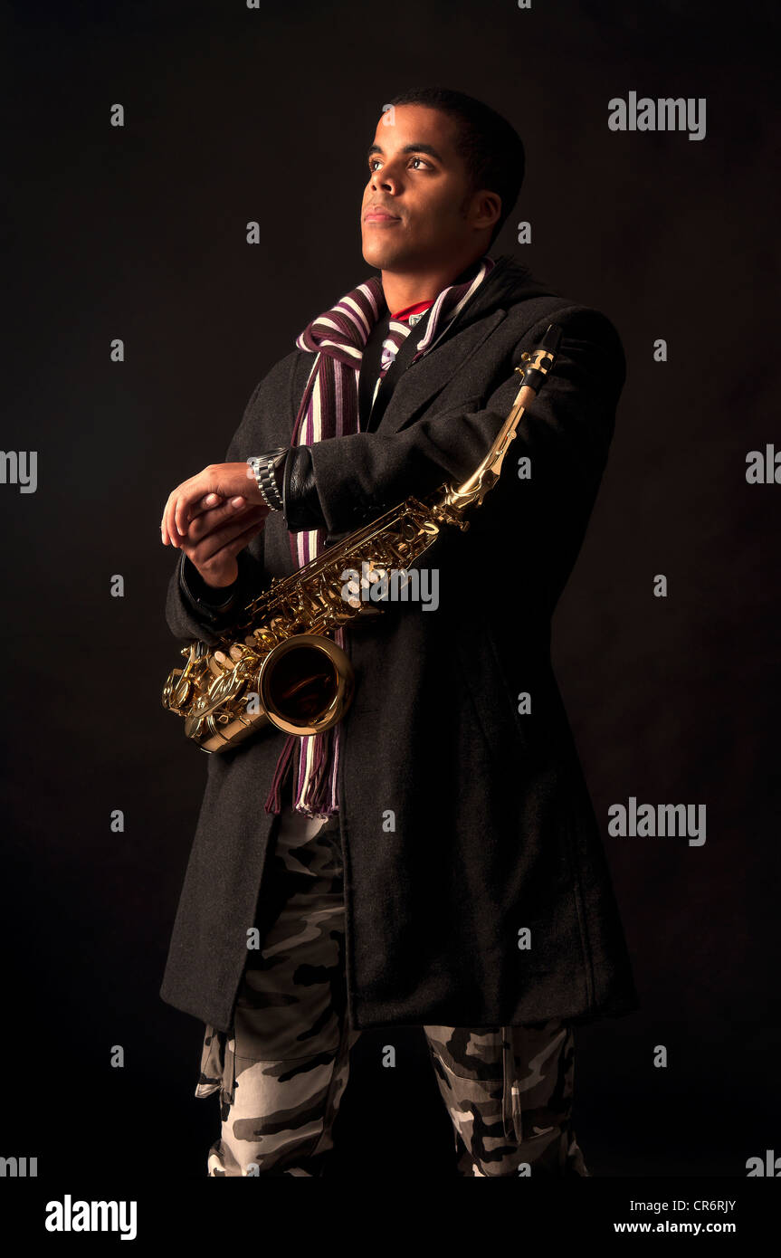 Stylish man playing the saxophone Stock Photo - Alamy