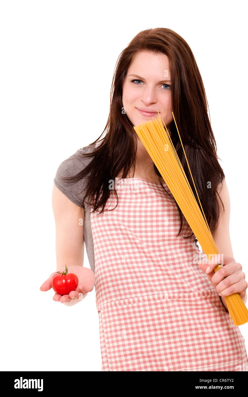 pretty young smiling woman holding spaghetti and tomato on white ...