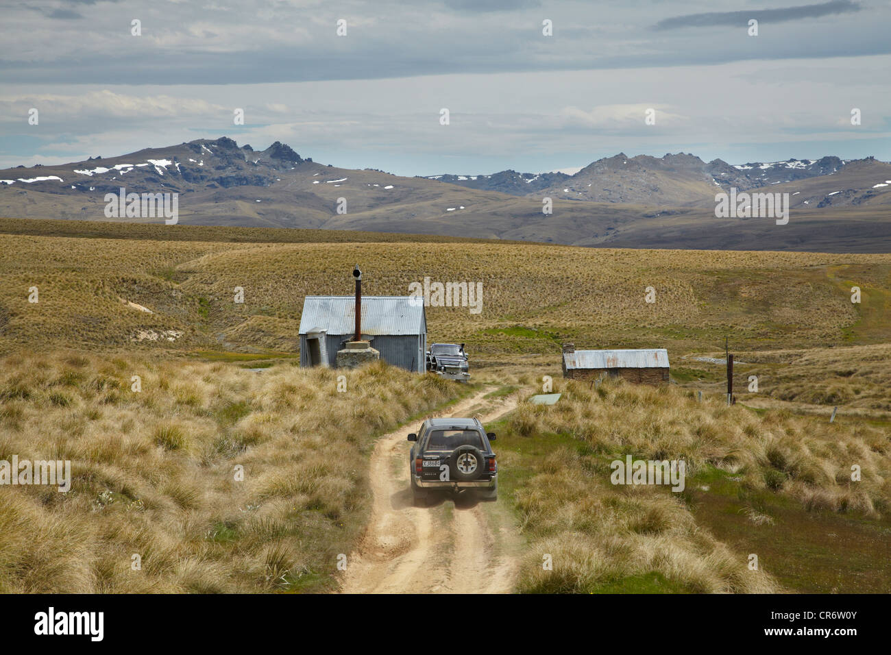 4wd and Potters Huts, by historic gold fields, Old Man Range, Southland ...