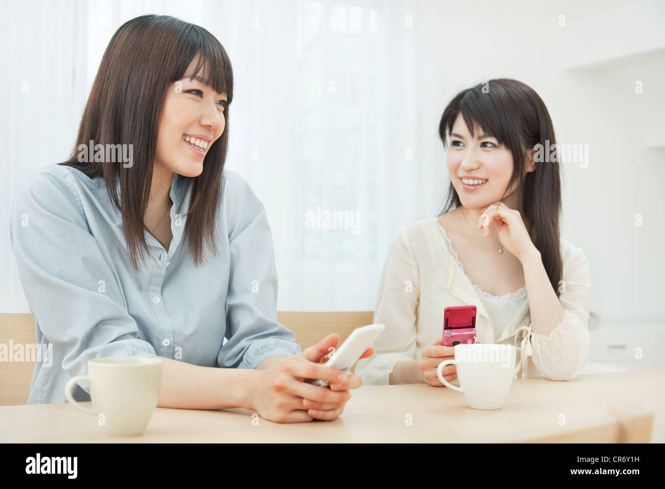 Two friends at home Stock Photo - Alamy