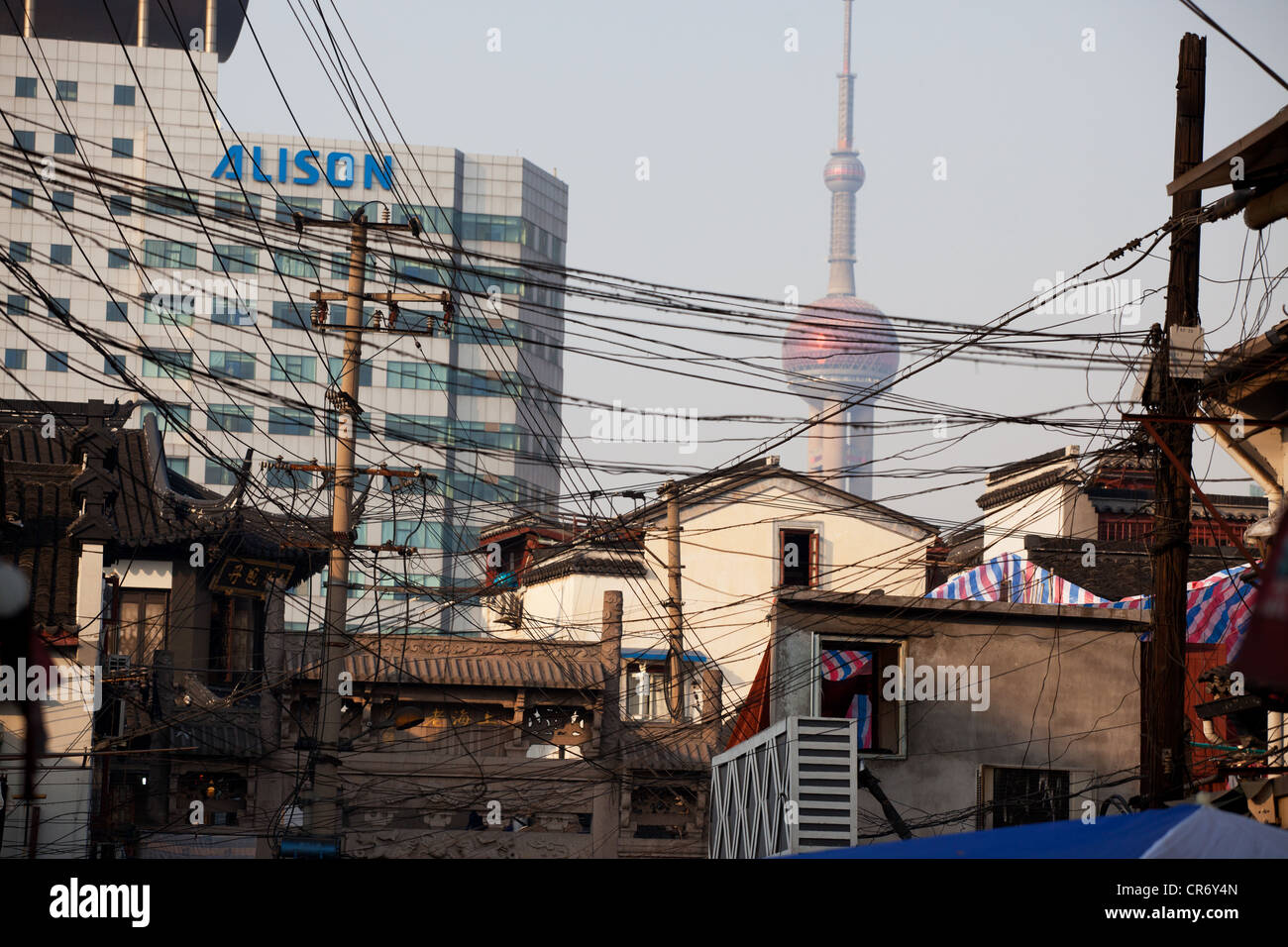 China Shanghai view of electrical cables and houses with pearl tower in ...
