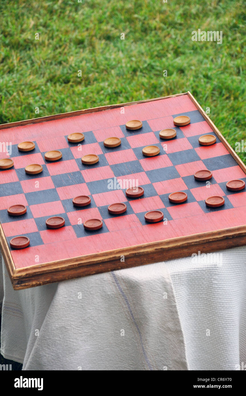 Old checkers on board Stock Photo - Alamy
