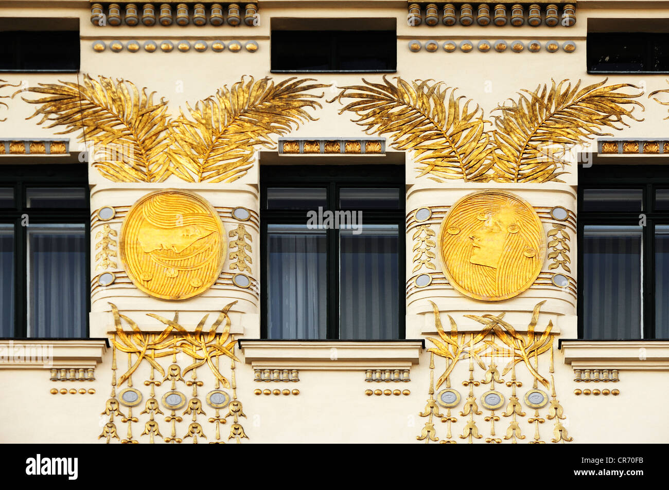 Portraits of women in medallions on a building facade, Art Nouveau ...