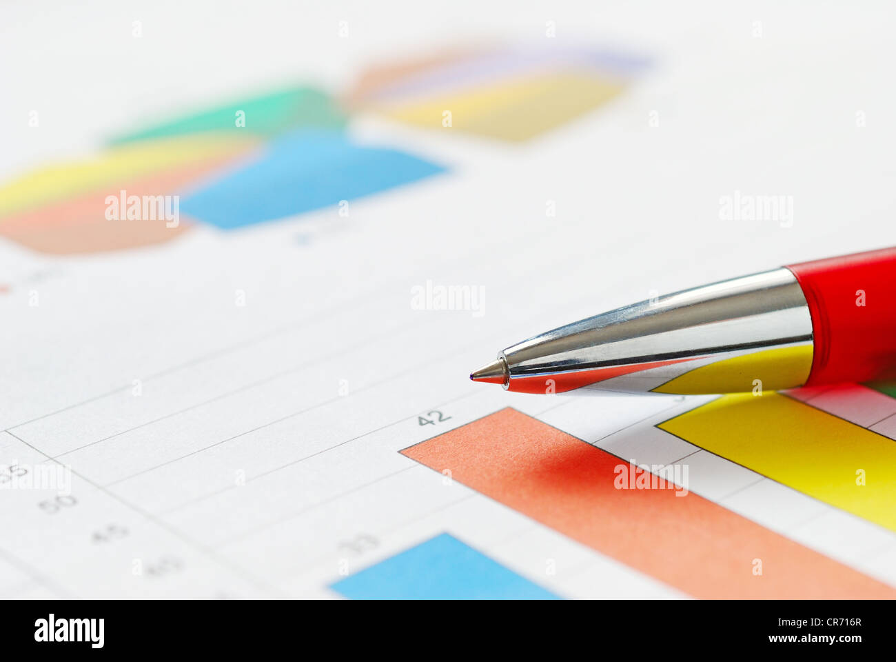 Close-up of red pen and financial graph Stock Photo - Alamy