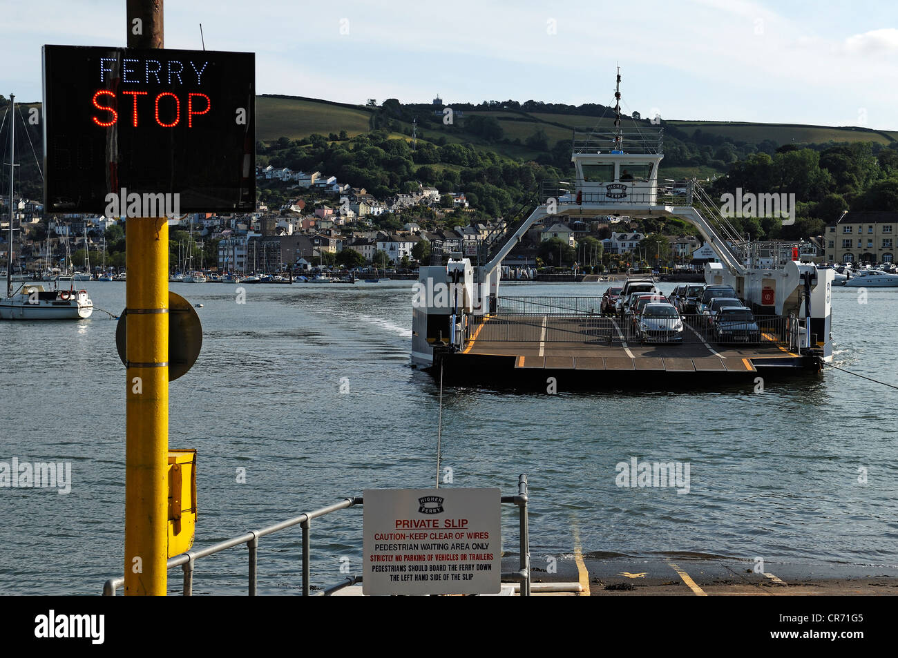 Car ferry crossing the Dart River in Kingswear, traffic light on the ...