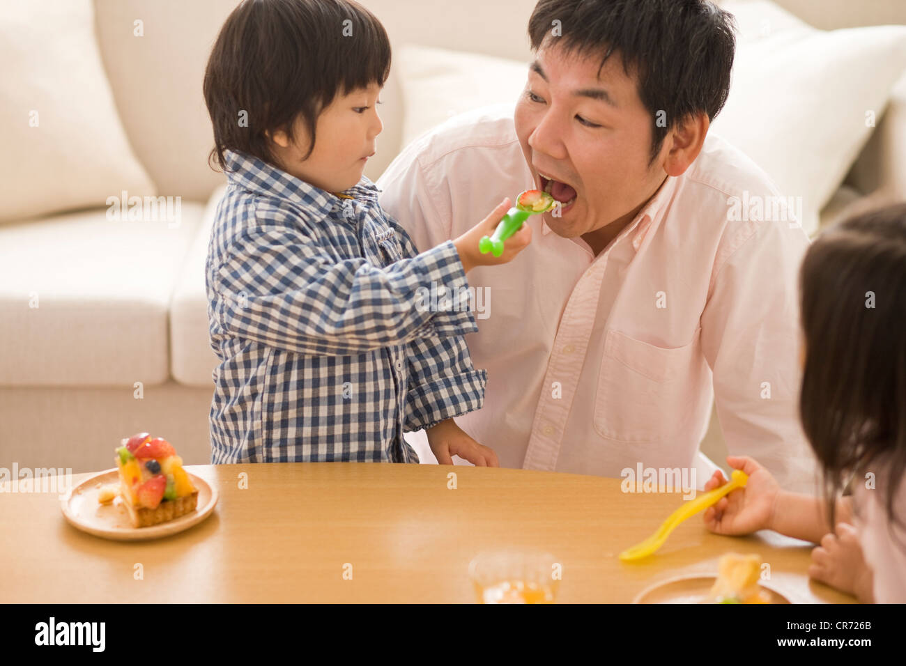 Side view daughter feeding hi-res stock photography and images - Alamy