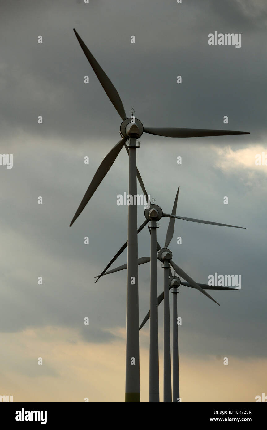 Four wind turbines against a grey sky, Harmshagen, Mecklenburg-Western ...