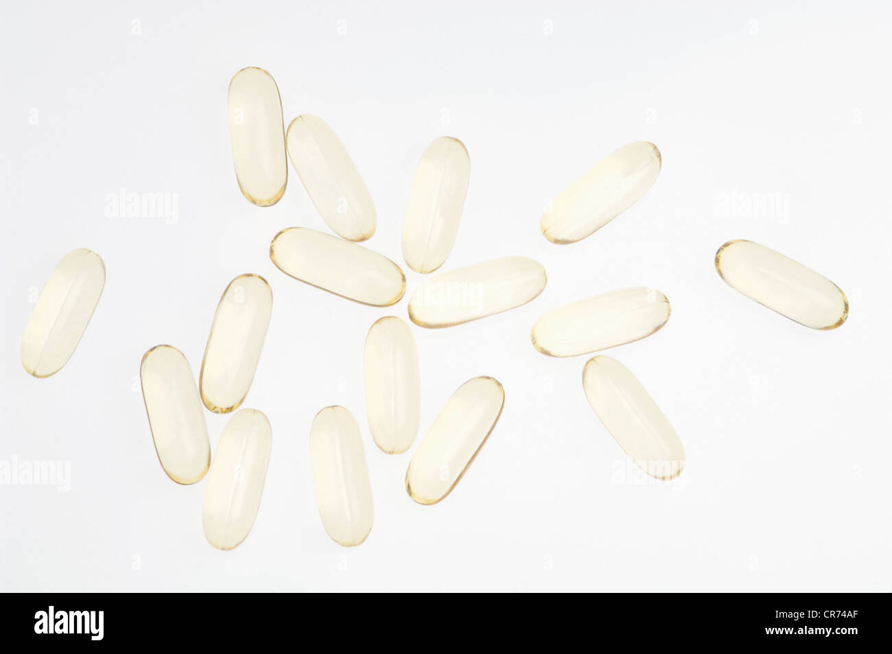 Transparent capsules on white background Stock Photo - Alamy