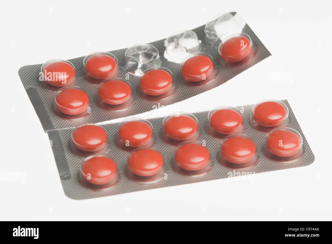 Red blister pack on white background Stock Photo - Alamy