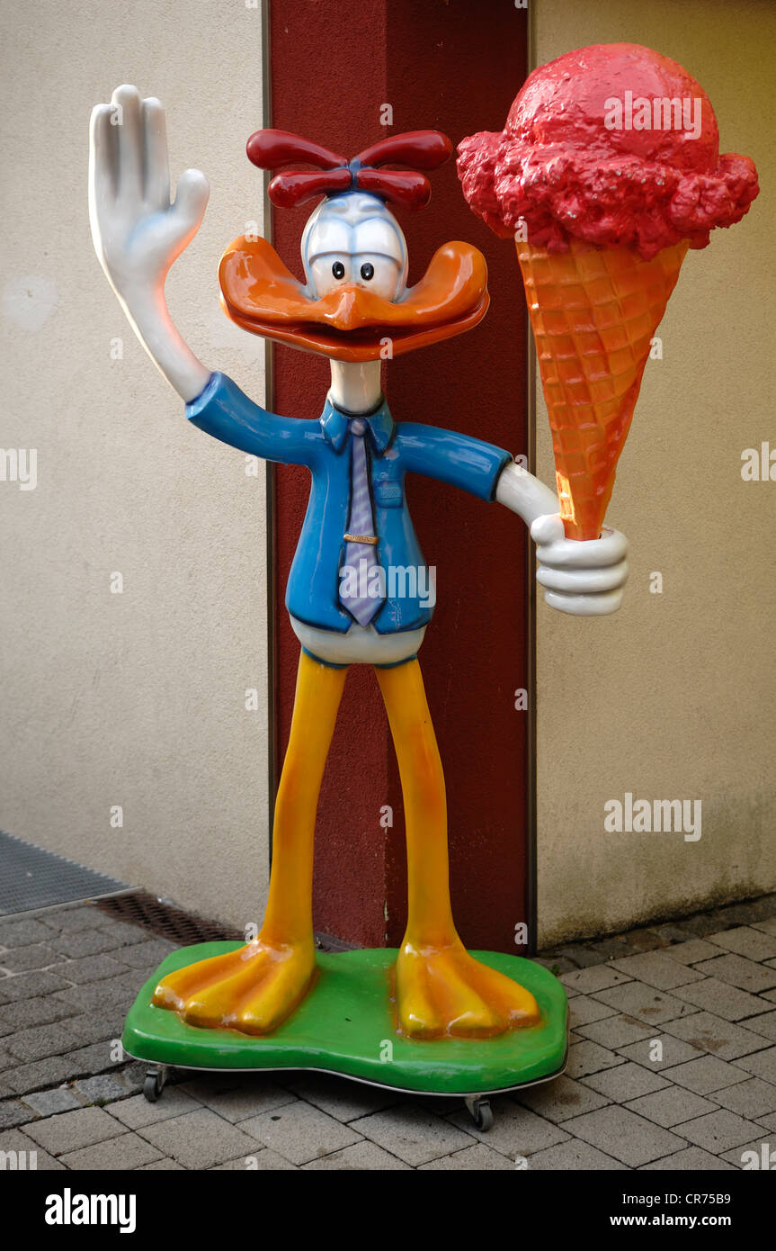 Large comic figure holding an ice-cream cone in front of an ice cream ...