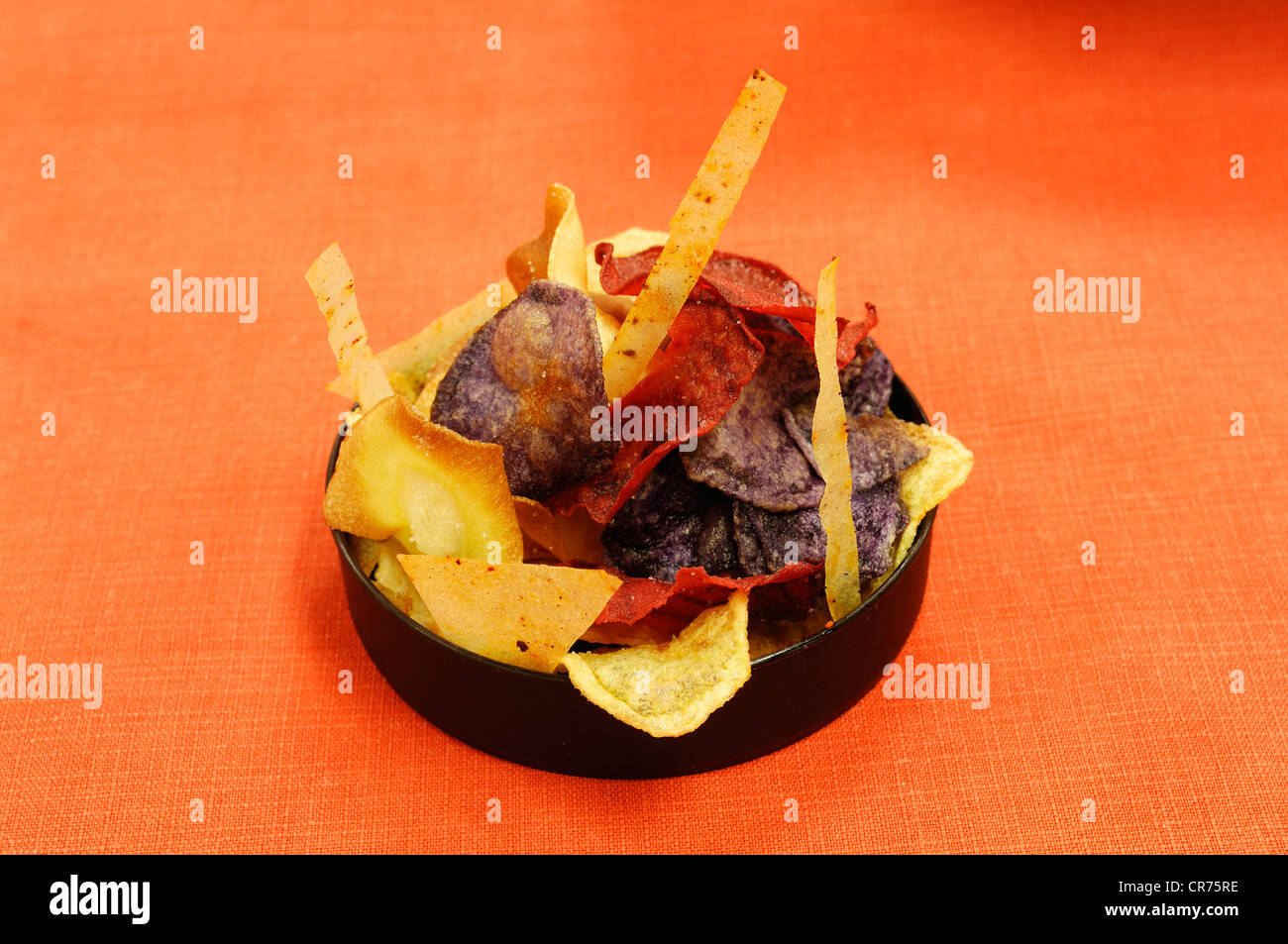Variety of vegetable chips in a small bowl, food Stock Photo - Alamy
