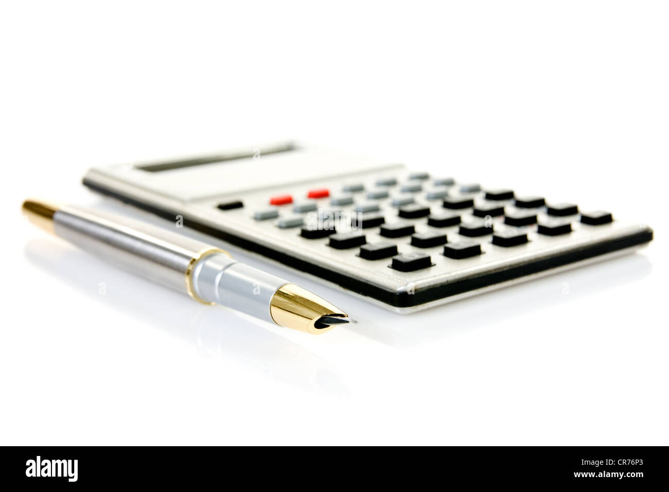 ink pen and calculator on white background Stock Photo - Alamy
