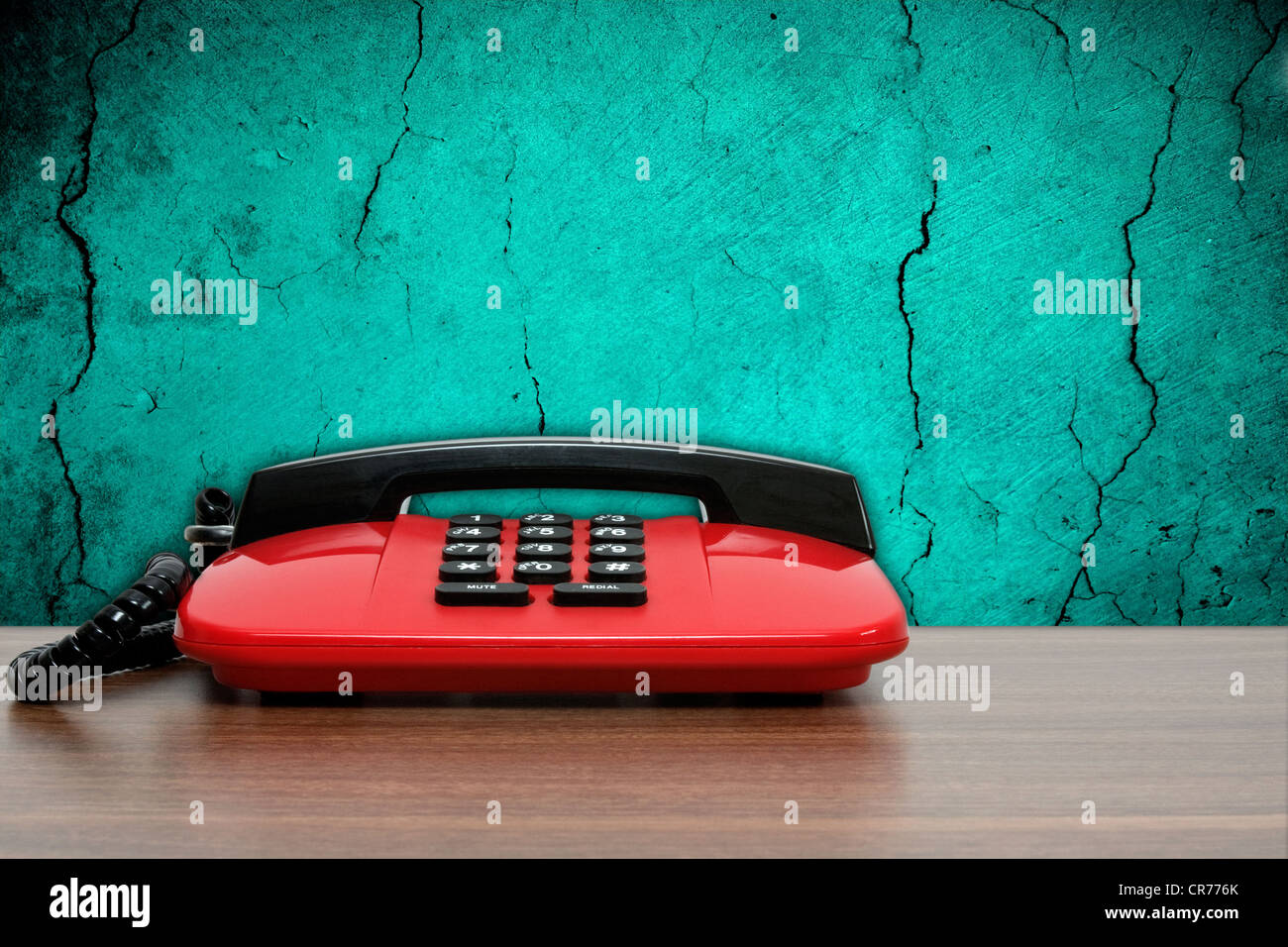red phone on dirty blue wall background Stock Photo - Alamy