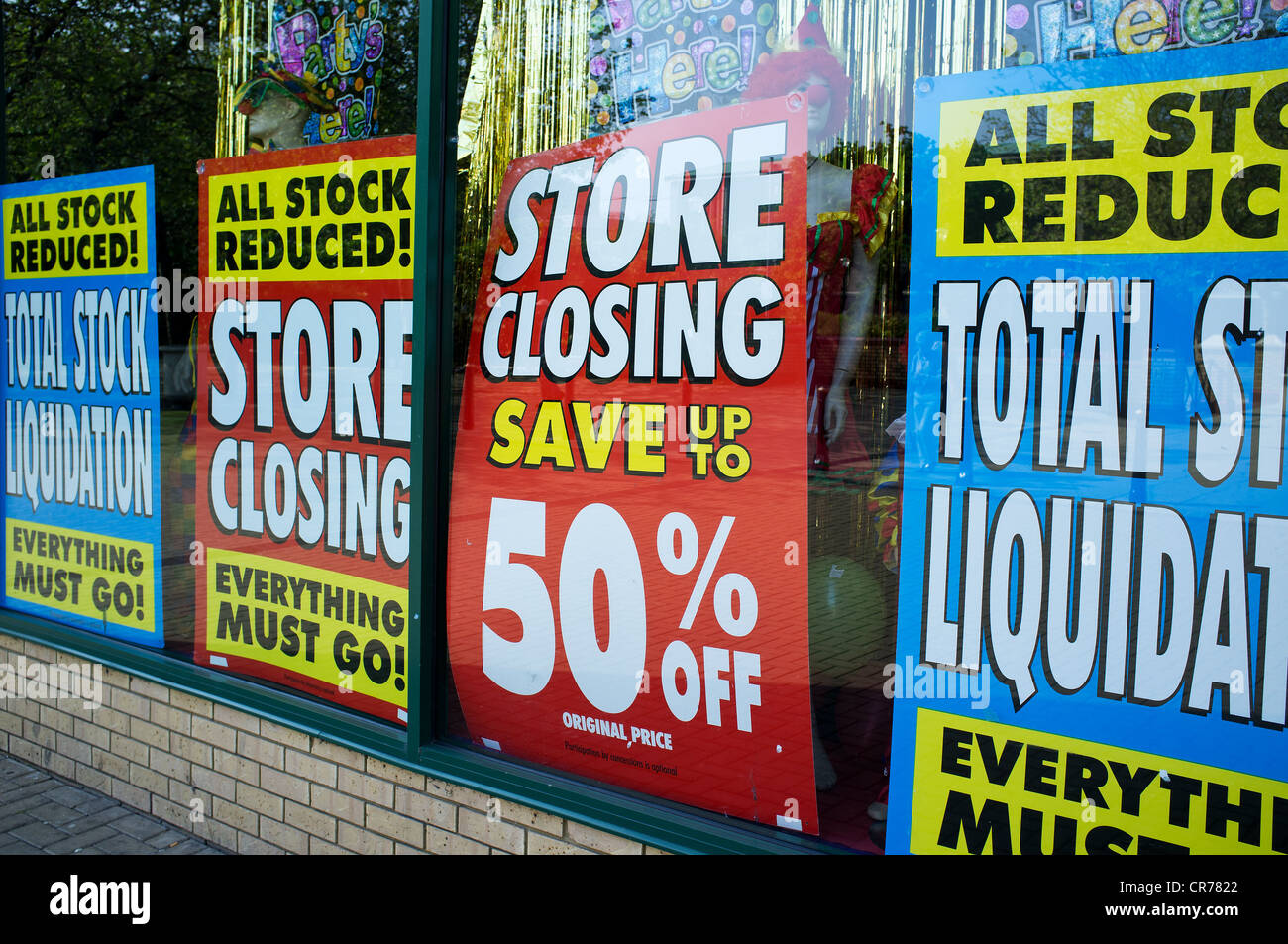 Sale signs in a shop window Stock Photo - Alamy