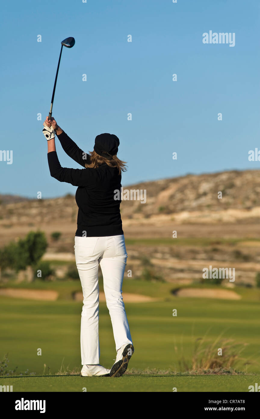 Cyprus, Woman playing golf on golf course Stock Photo - Alamy