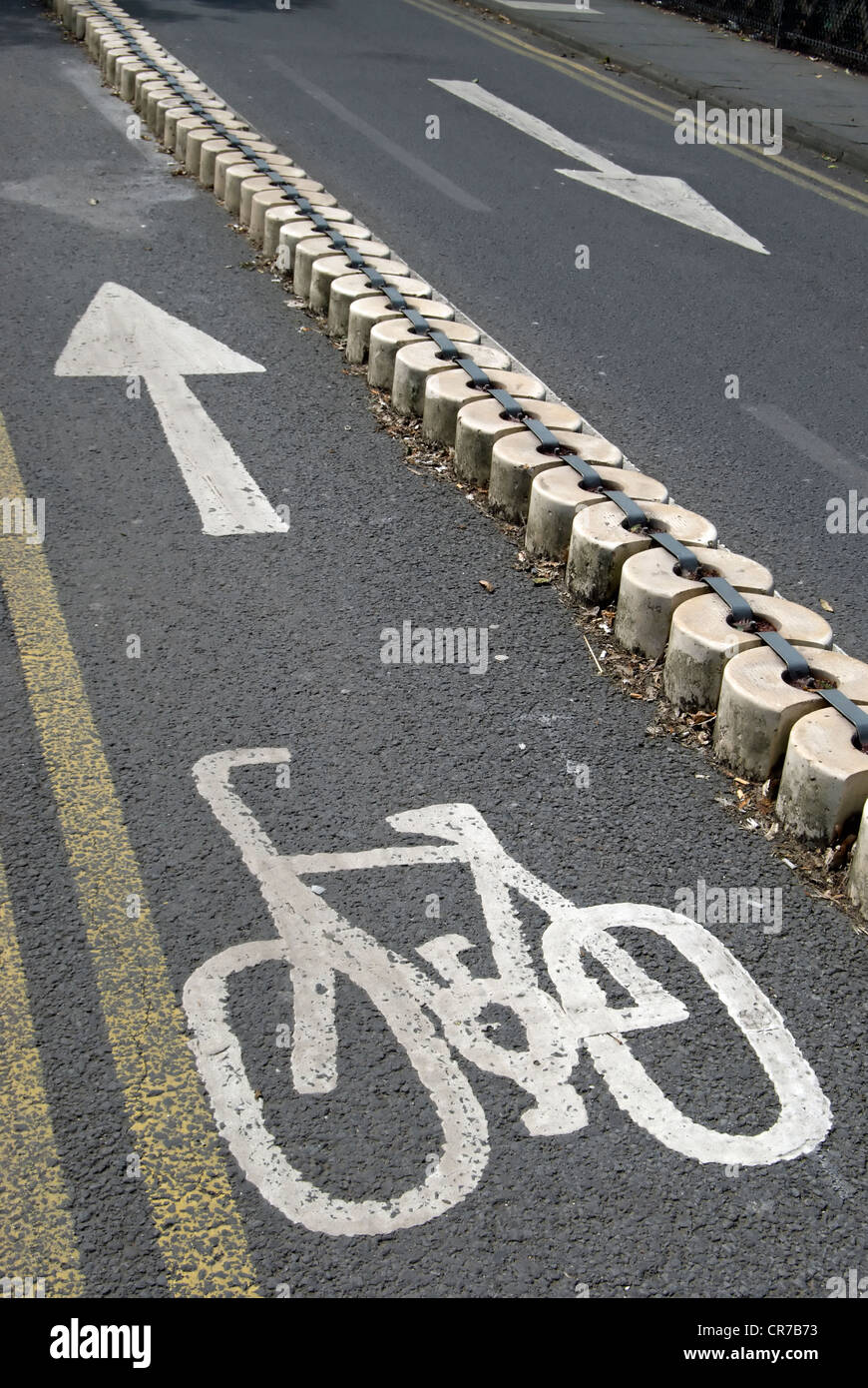 cycle lane separated from vehicular traffic by a line of concrete ...