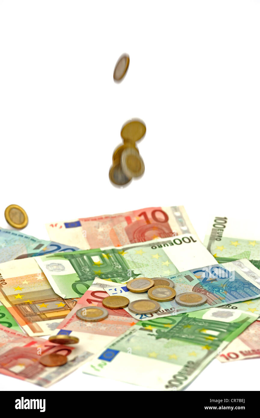 Euro coins falling onto Euro banknotes, symbolic image for windfall ...