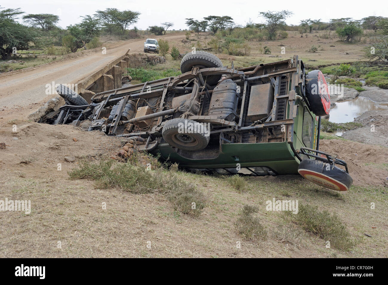 Safari car having fallen into a stream, Toyota Land Cruiser, Masai Mara ...