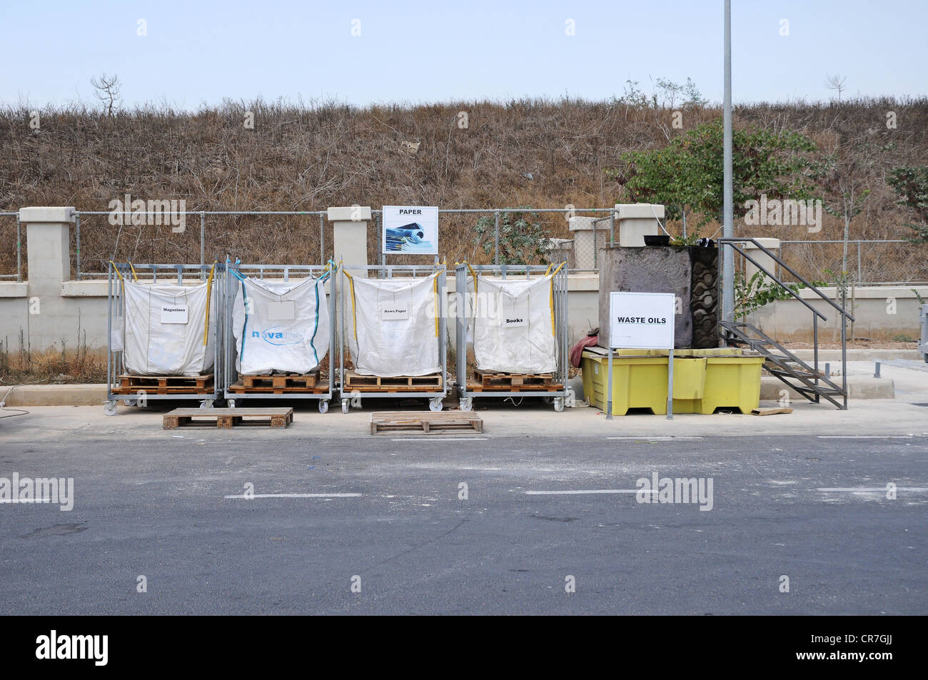 A civic amenity site where different recyclable materials are separated ...