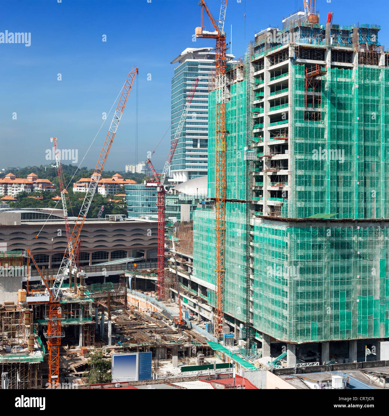 Building house construction site with cranes. Square format Stock Photo ...
