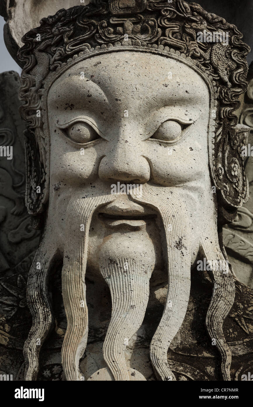 Wat Pho Chinese stone guardian face close up, Bangkok, Thailand Stock ...