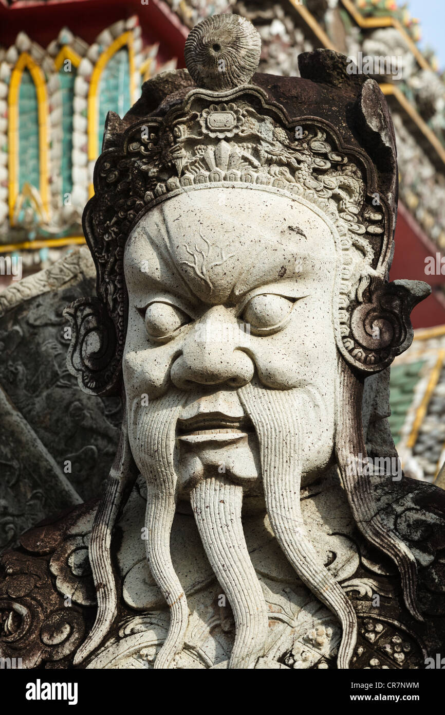 Wat Pho Chinese stone guardian face close up, Bangkok, Thailand Stock ...