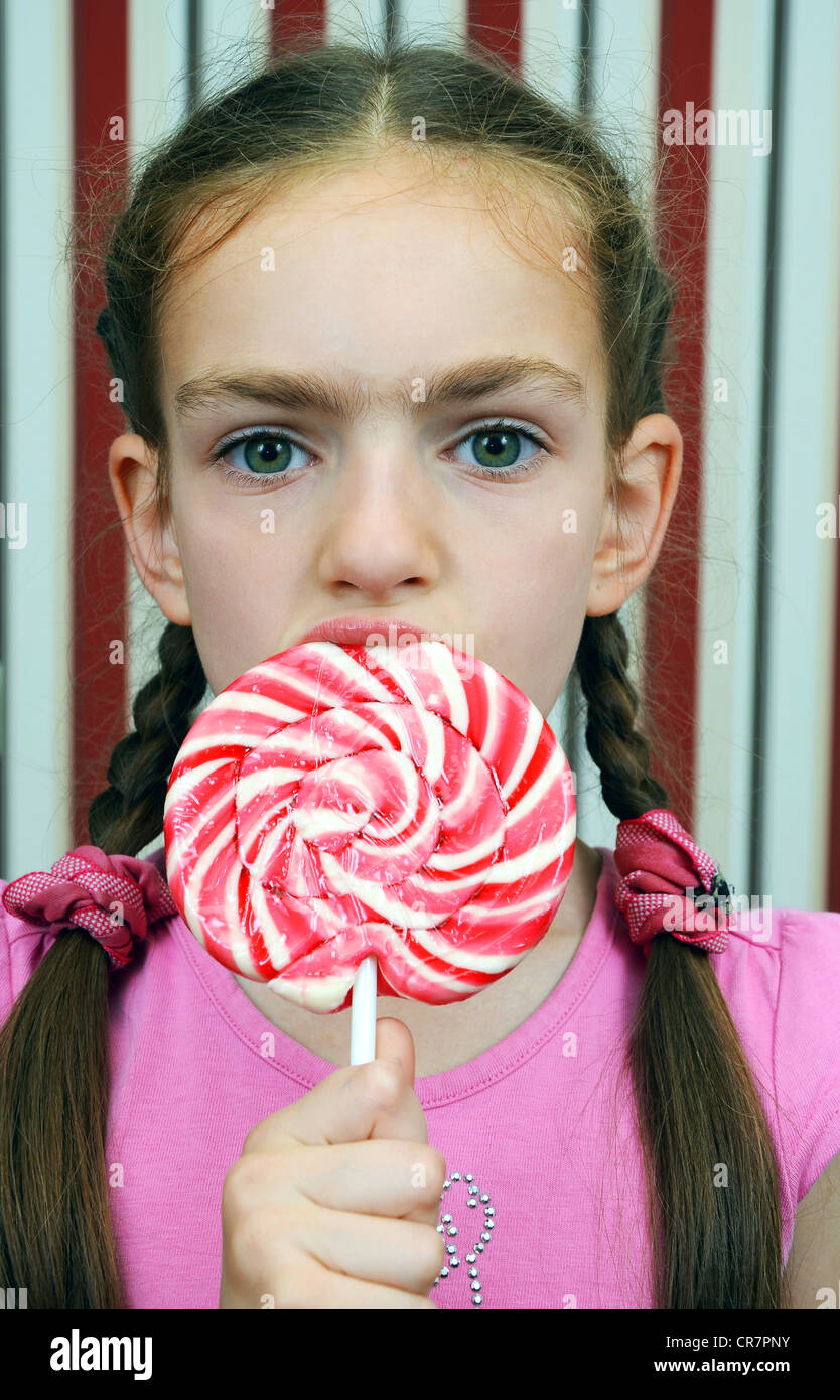 beauty girl with a big candy lollipop Stock Photo - Alamy