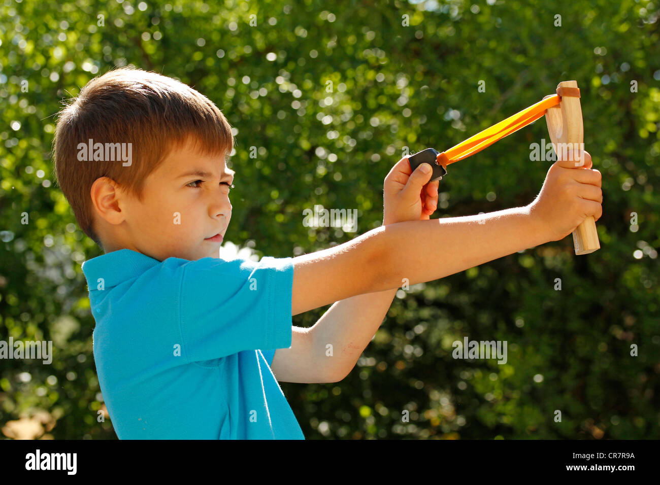 Boy and slingshot Stock Photo - Alamy