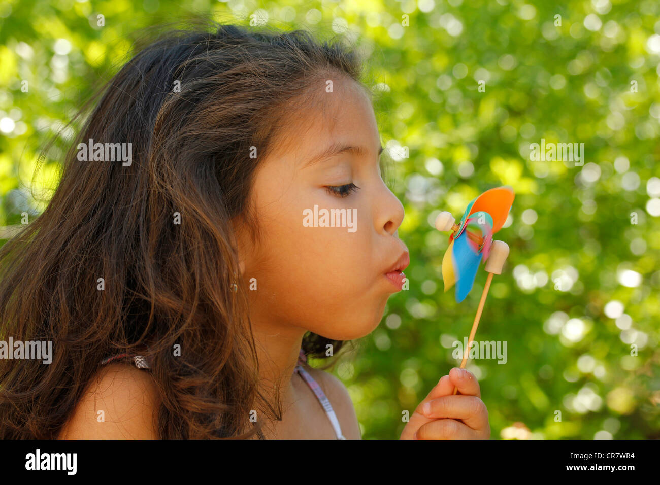 Blowing a windmill Stock Photo - Alamy