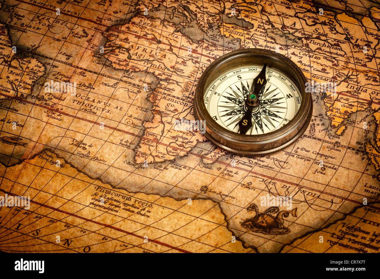 Old vintage retro compass on ancient map Stock Photo - Alamy