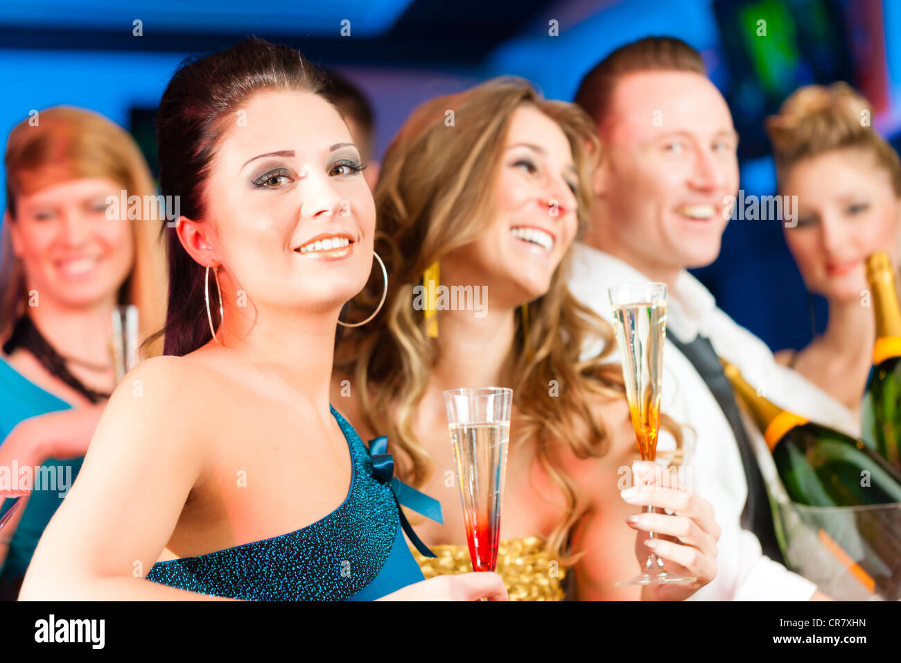 Young people in club or bar drinking champagne and having fun Stock ...