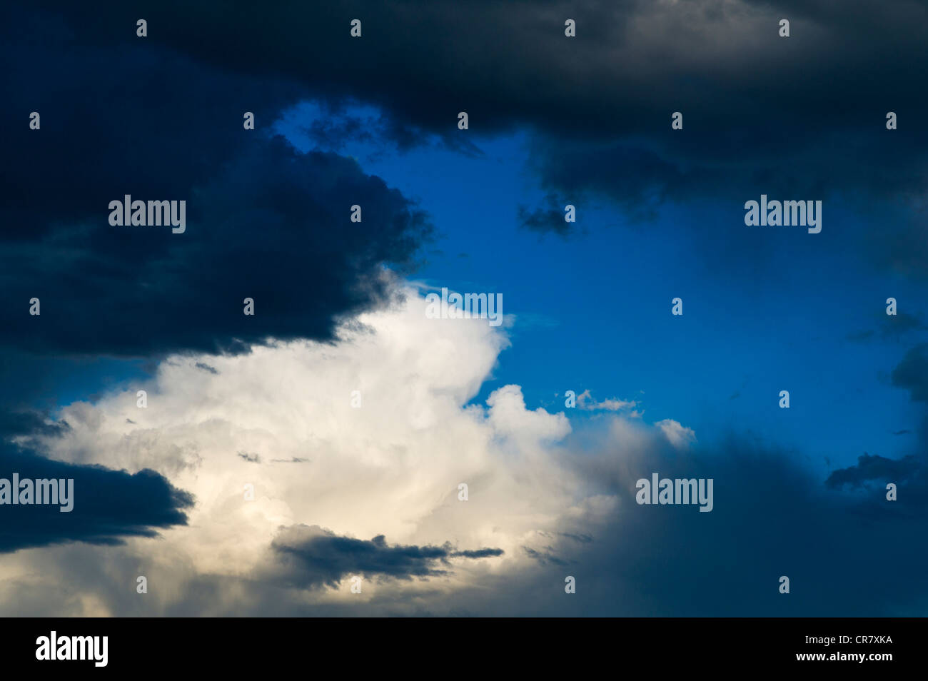 Puffy white cumulus storm clouds against a clearing blue sky Stock ...