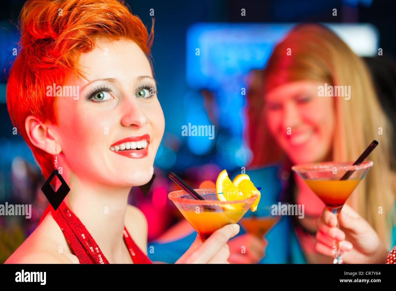 Young women in club or bar drinking cocktails and having fun Stock ...