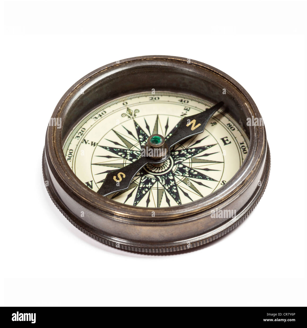 Old vintage retro brass compass isolated Stock Photo - Alamy