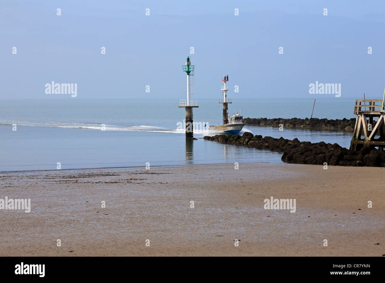 Small fishing vessel entering the Grandcamp-Maisy harbour in Normandy ...