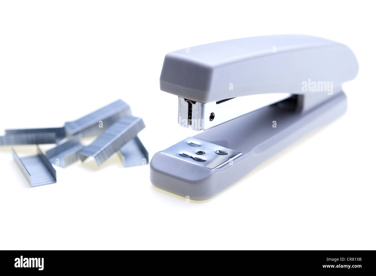 Grey stapler with staples Stock Photo - Alamy