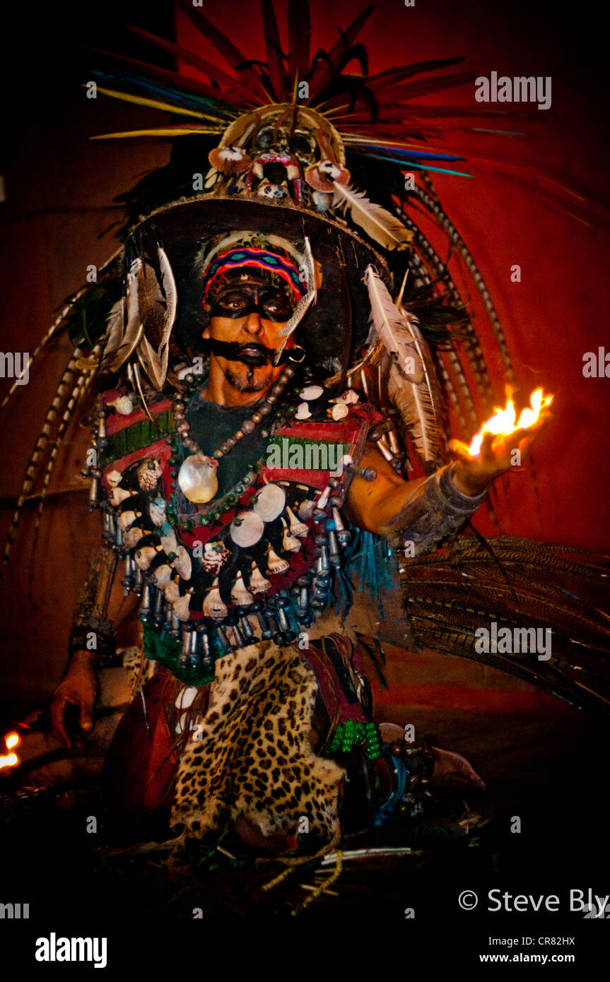The Mayan ritual of fire dance is performed by a Maya dancer as he ...