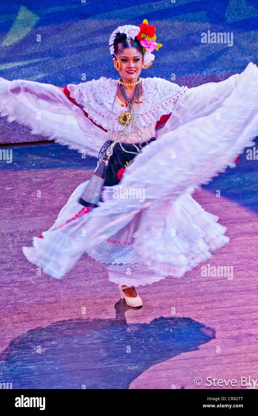 Beautiful Maya dancer in traditional dress performing a folklore dance ...